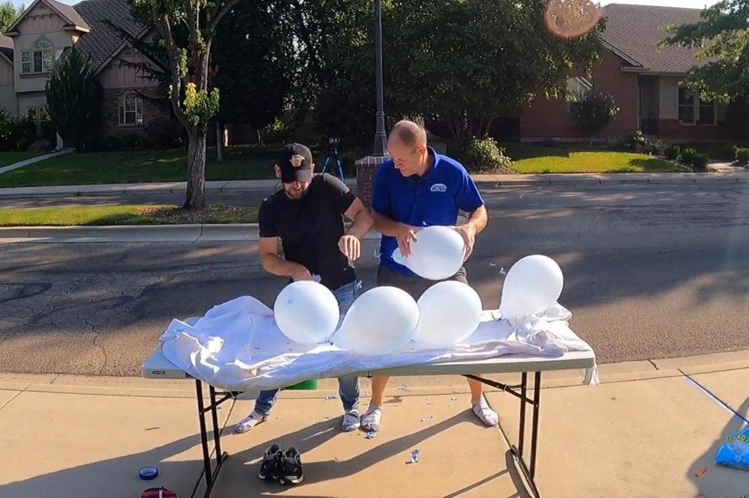 Men attempt record by popping balloons between their bodies - Radio Sargam